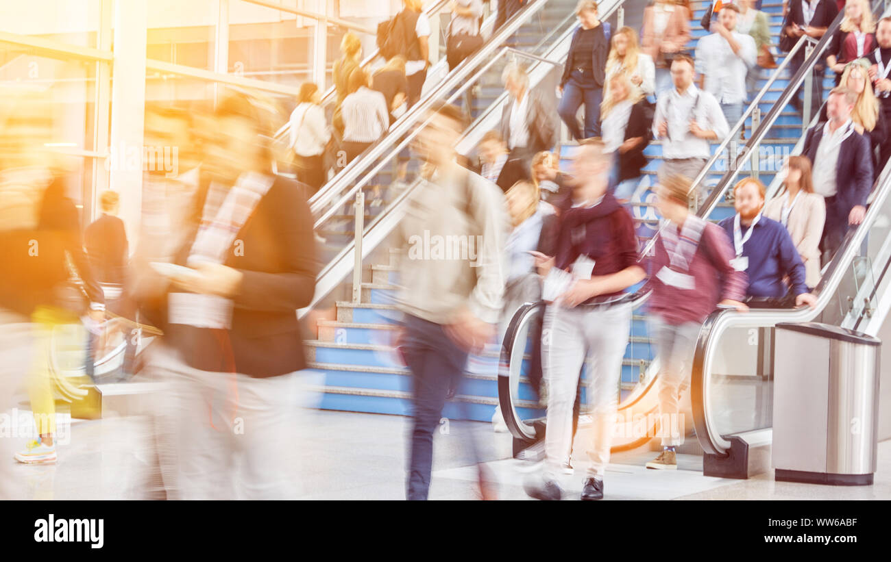 Anonymous crowd of people on stairs at trade fair event Stock Photo - Alamy