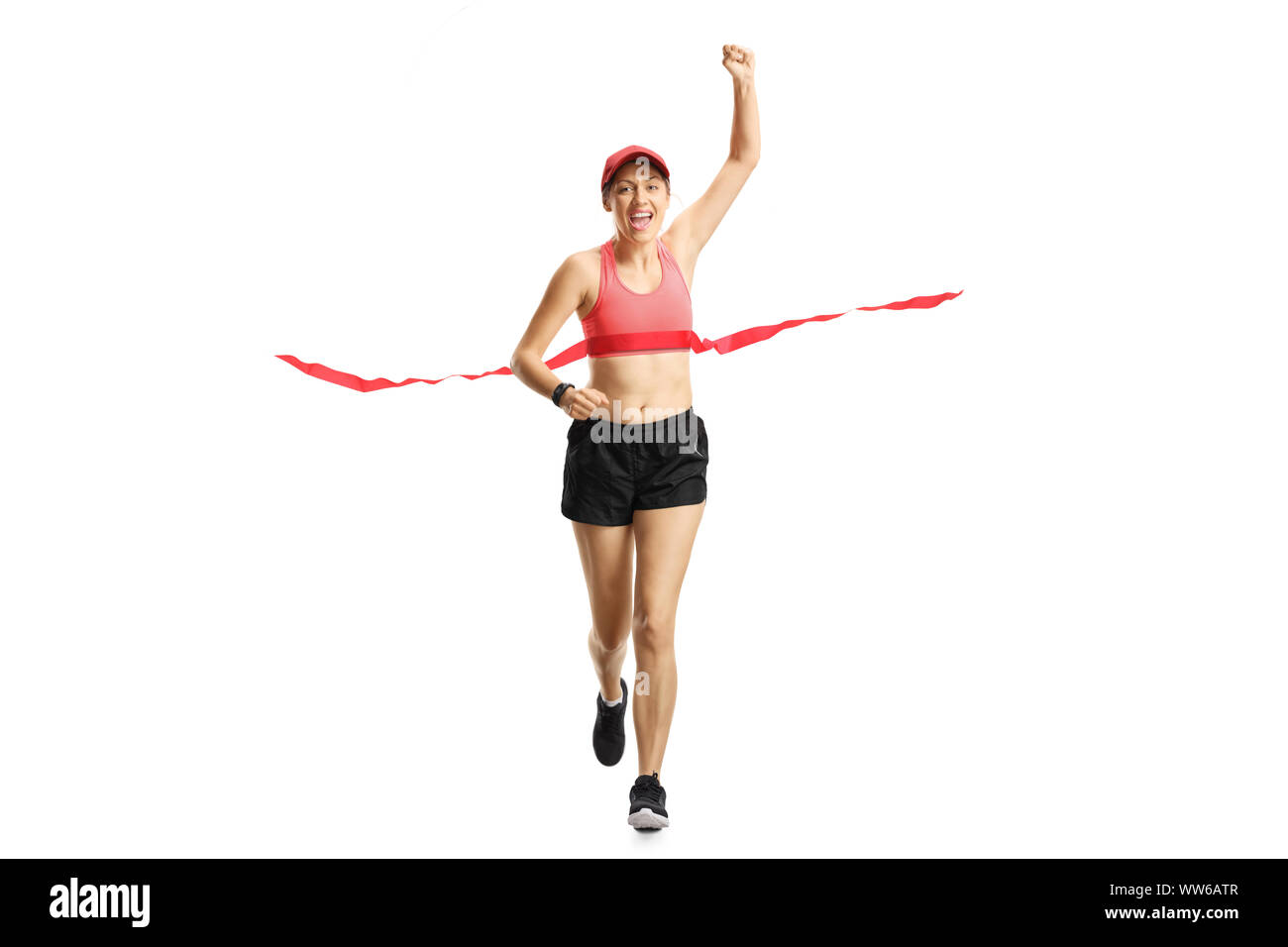 Full length portrait of a young woman on the finish line of a race ...