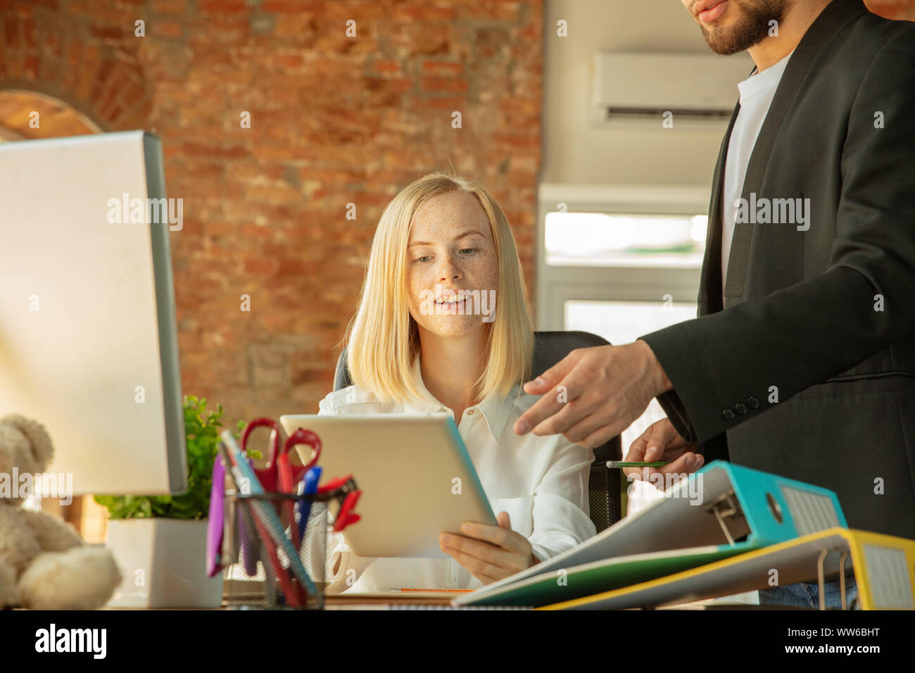 A young businesswoman moving in the office, getting new work place ...