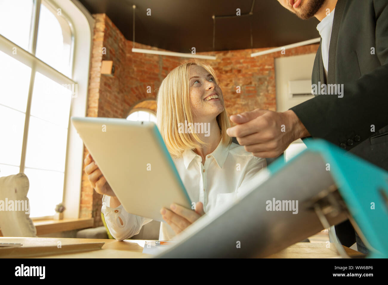 A young businesswoman moving in the office, getting new work place ...
