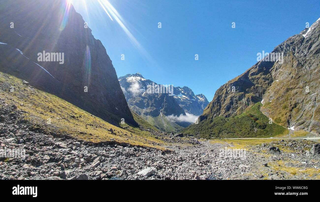 Snowy mountain on the horizon with steppe and big stones in front of it ...