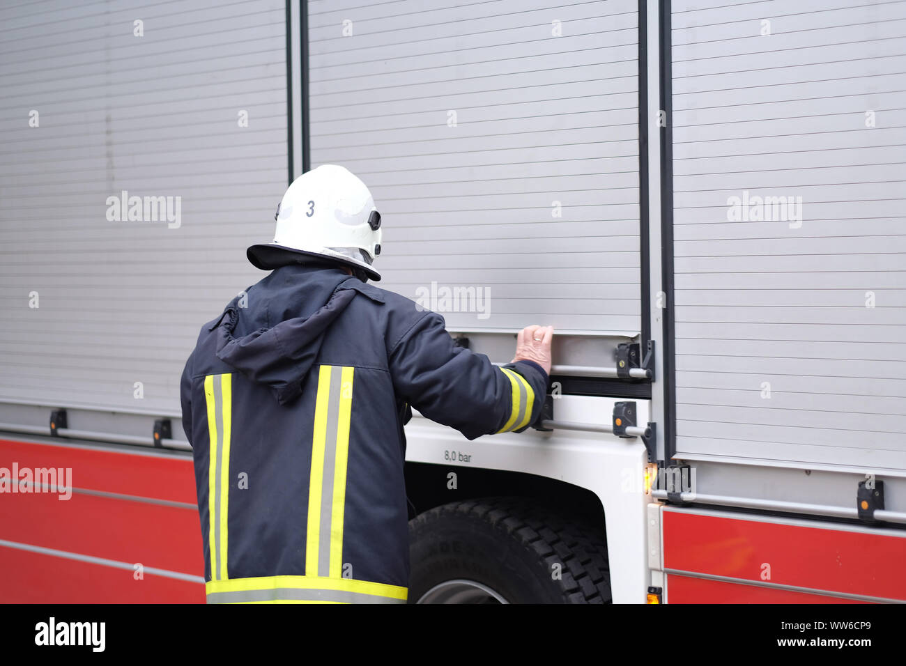The fireman closes the units with the equipment on board the fire ...
