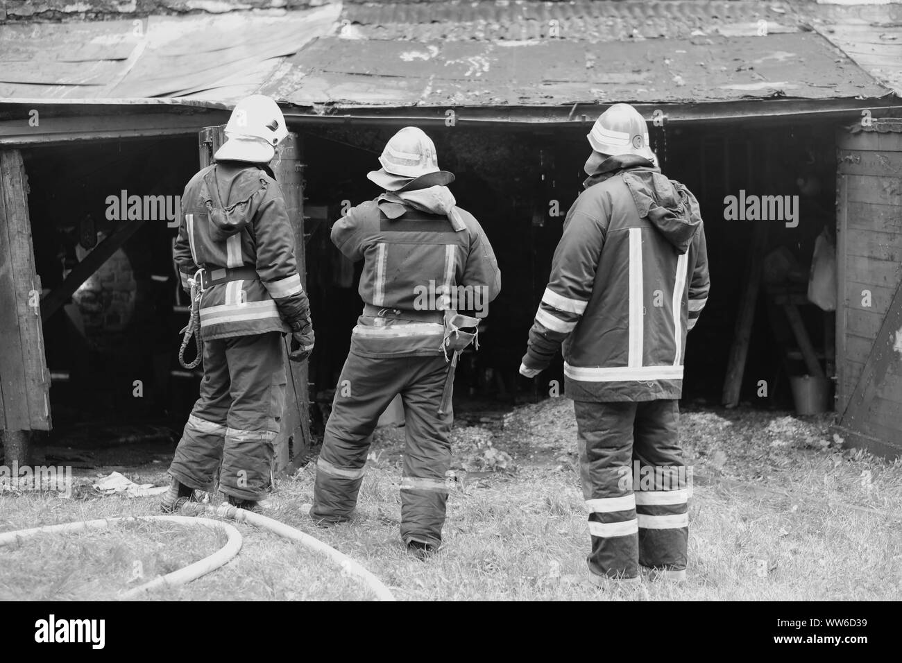 Team firefighters in place after fire extinguishment Stock Photo - Alamy