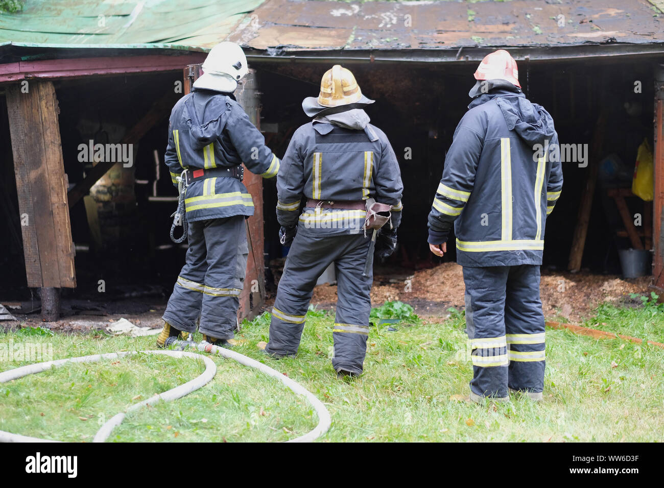 Team firefighters in place after fire extinguishment Stock Photo - Alamy