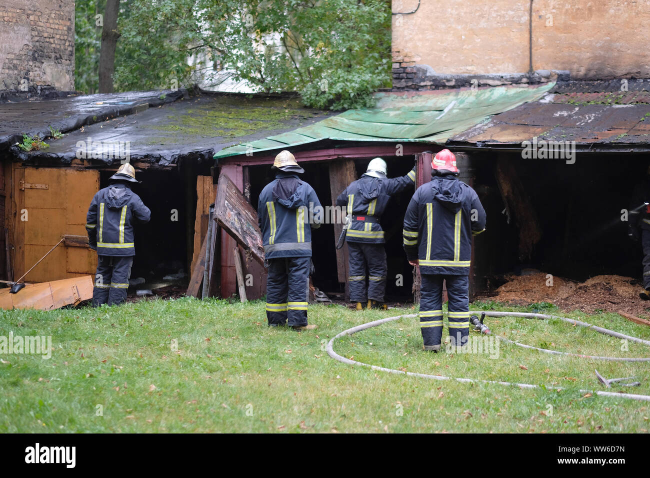 Team firefighters in place after fire extinguishment Stock Photo - Alamy