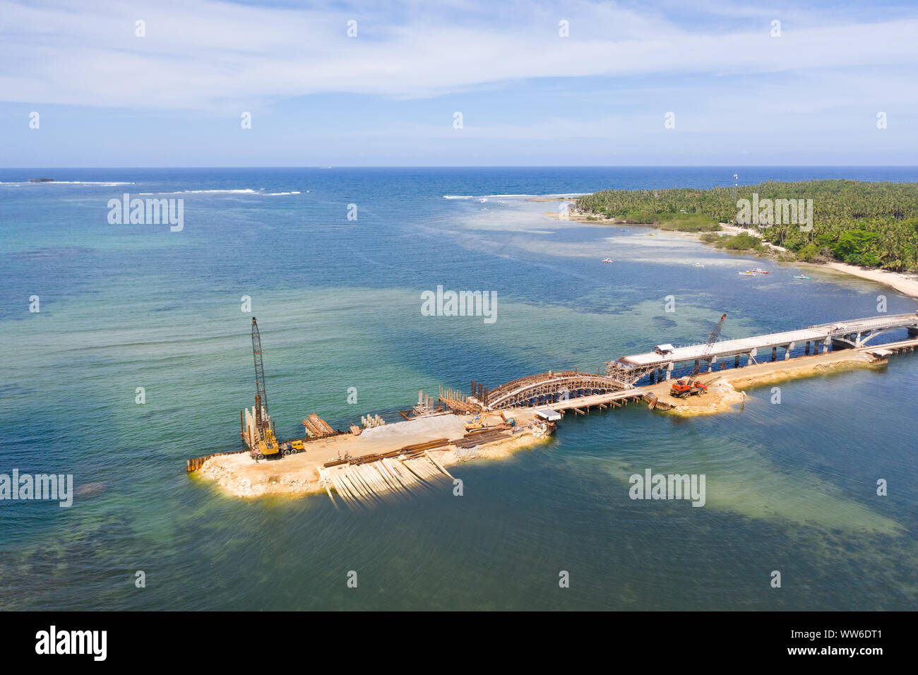 Construction of a bridge across the bay. Construction equipment on the ...