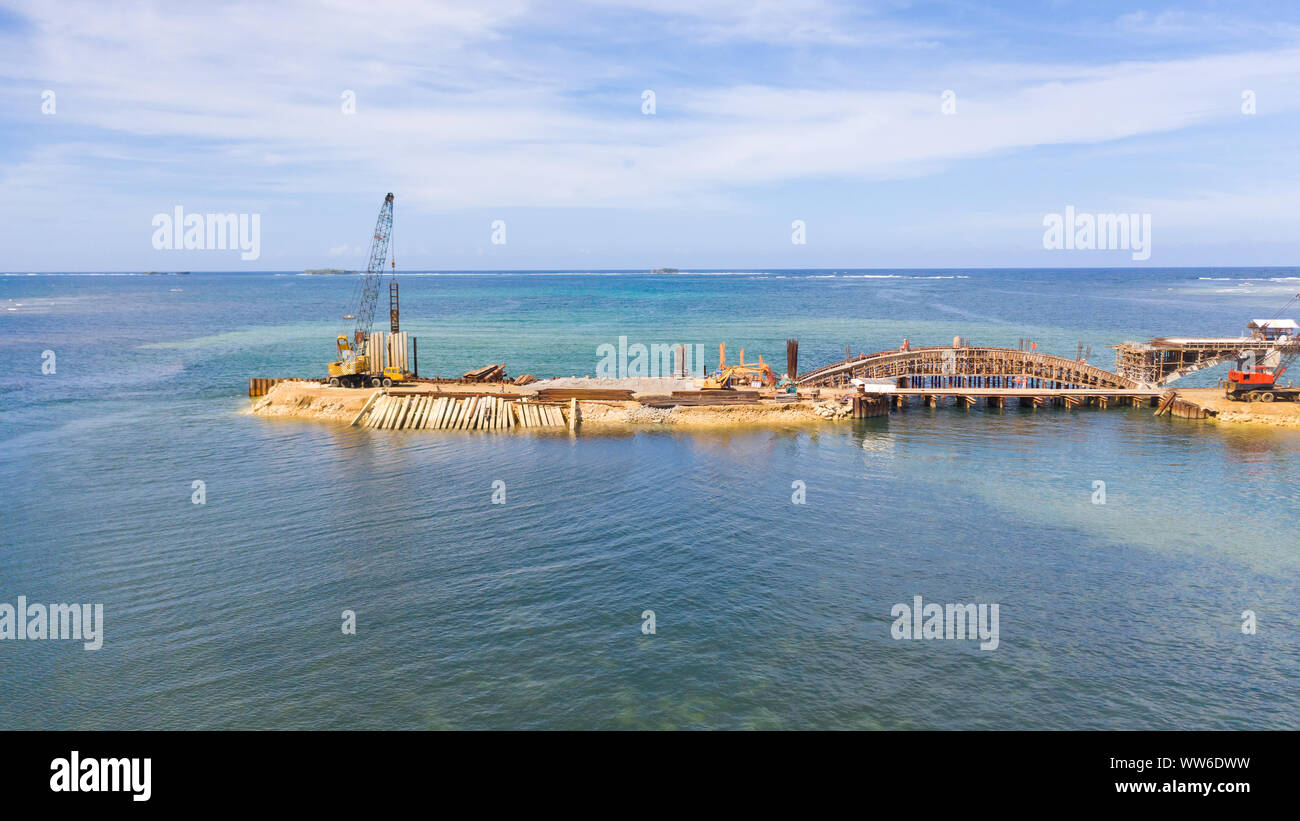 Construction of a bridge across the bay. Construction equipment on the ...