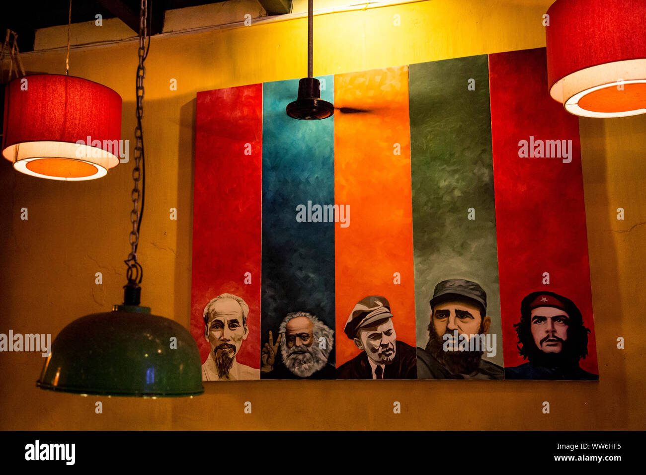 Restaurant in Vietnam, inside, image with familiar faces of communism ...