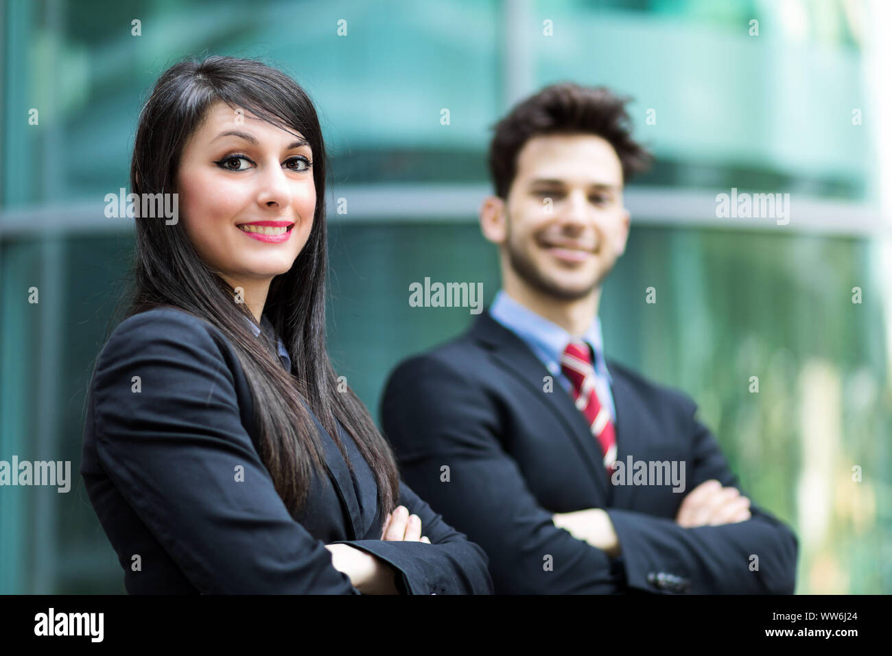 Business partners outdoor smiling confidently Stock Photo - Alamy