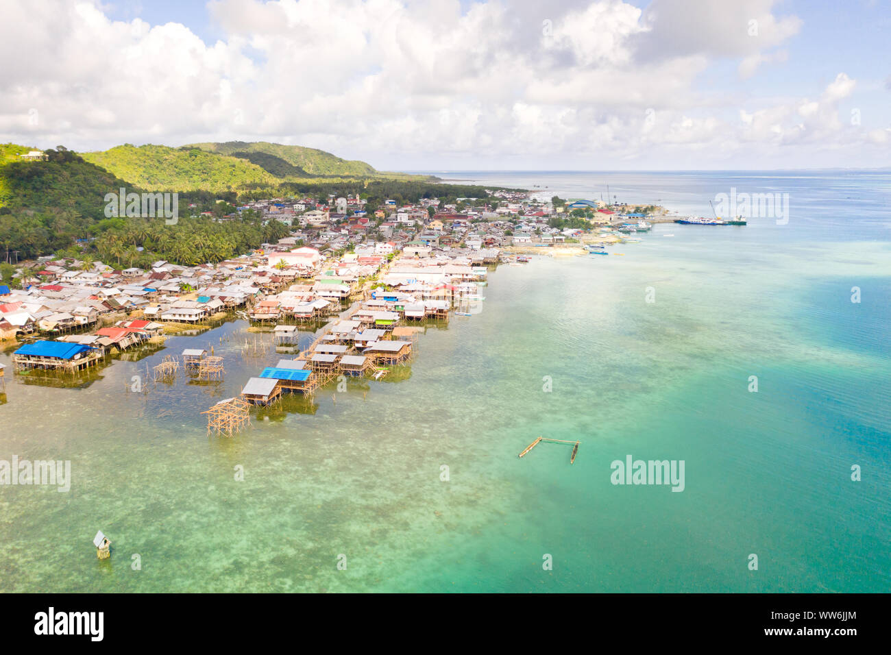 Sea port in the city of Dapa, Philippines. Fishing village and ships ...