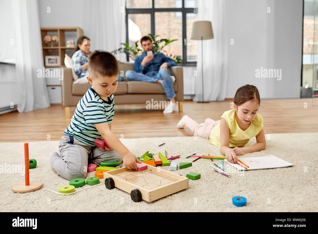 brother and sister playing and drawing at home Stock Photo - Alamy