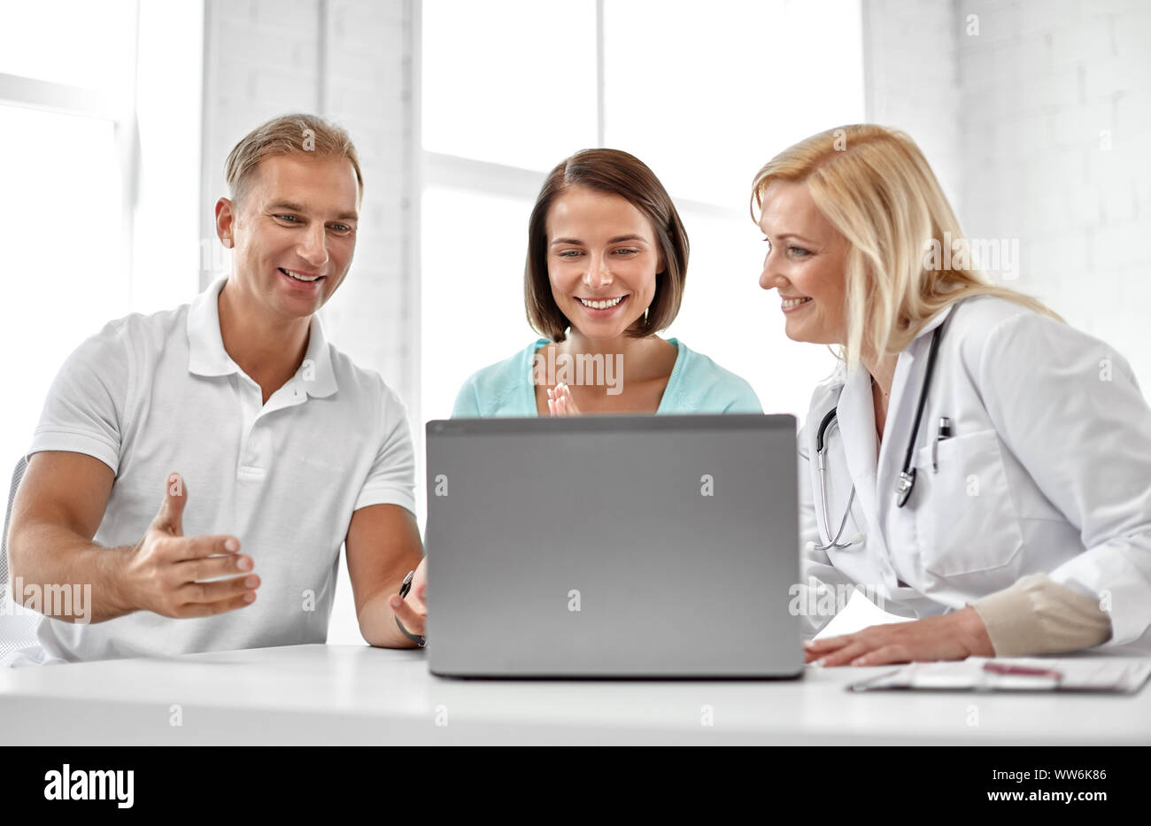couple visiting doctor at family planning clinic Stock Photo - Alamy