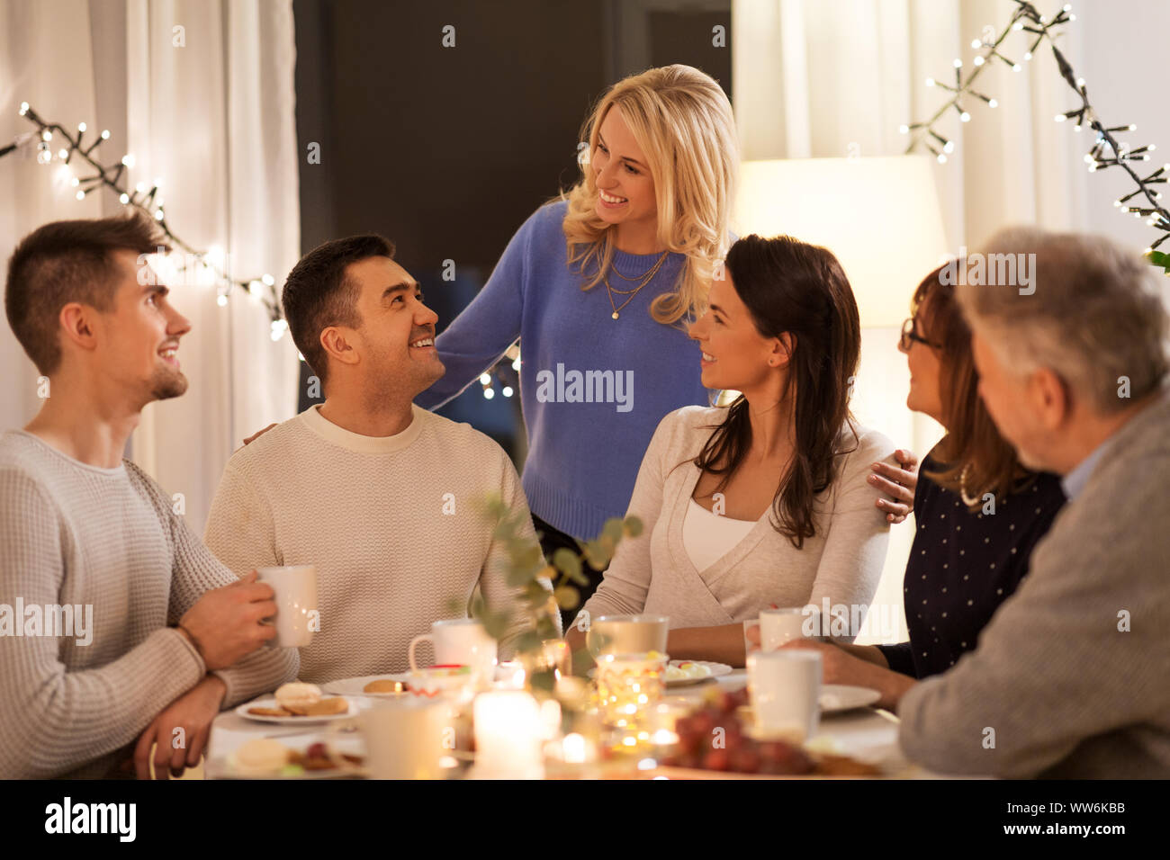 happy family having tea party at home Stock Photo - Alamy