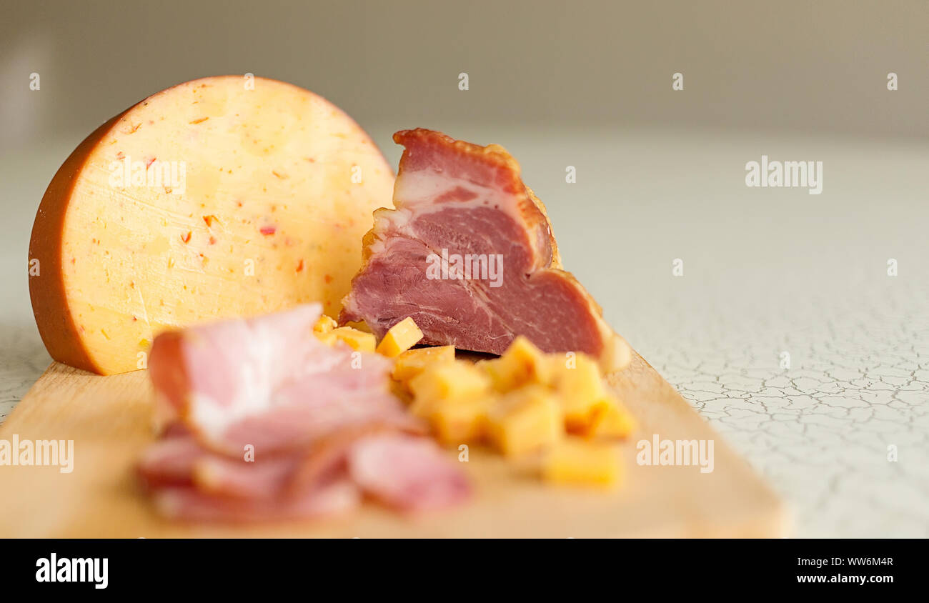 Ham and cheese on a wooden chopping board Stock Photo - Alamy