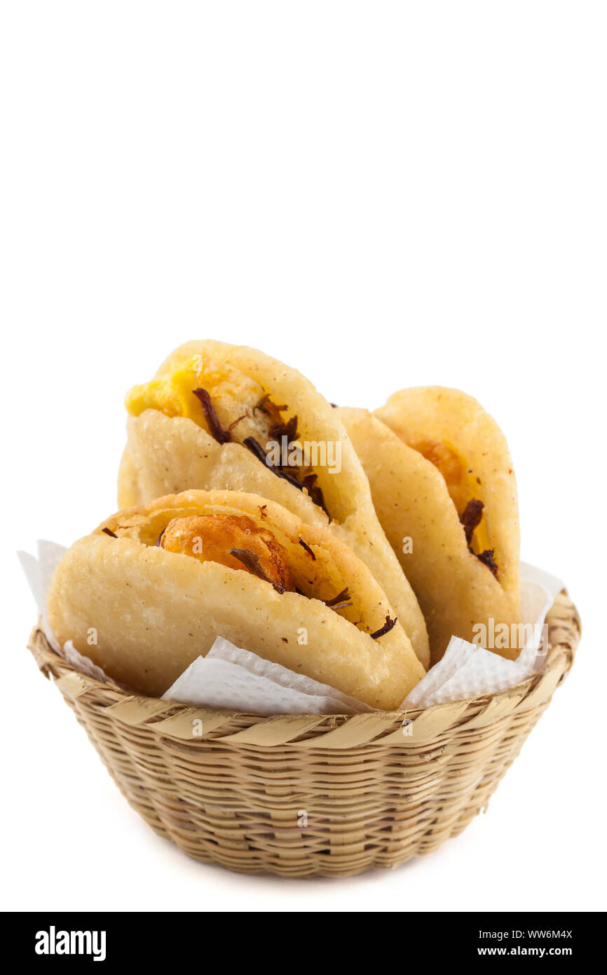 Arepa de huevo. Traditional Colombian fried arepa filled with egg and ...