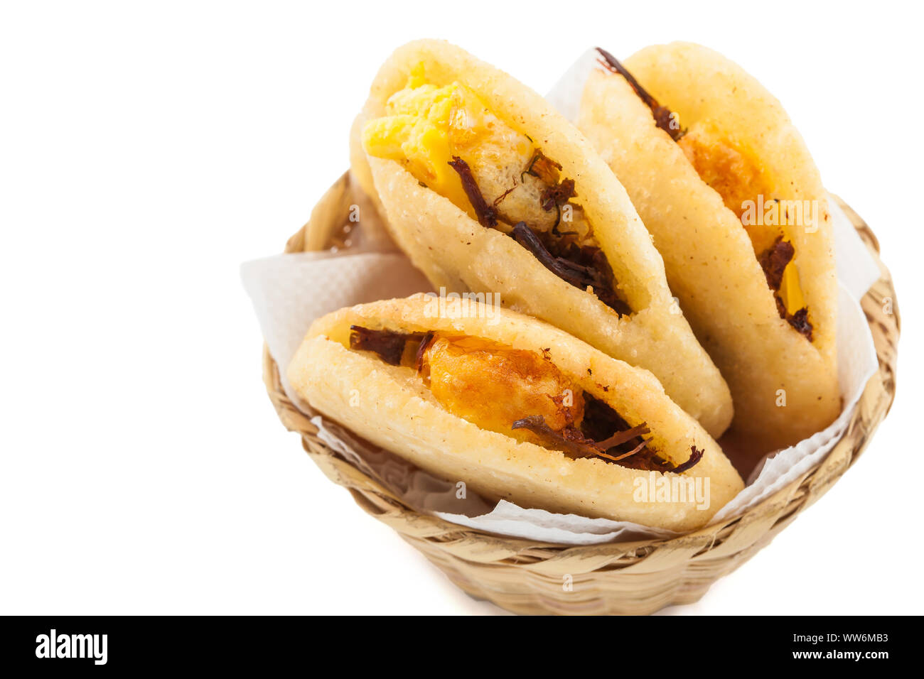 Arepa de huevo. Traditional Colombian fried arepa filled with egg and ...