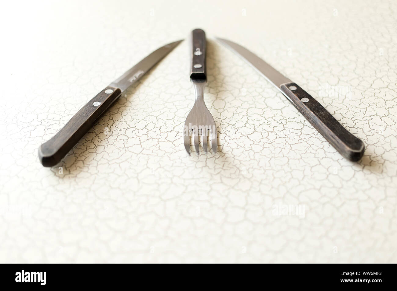 Cutlery. Composition of cutlery Two knife and fork on the table ...