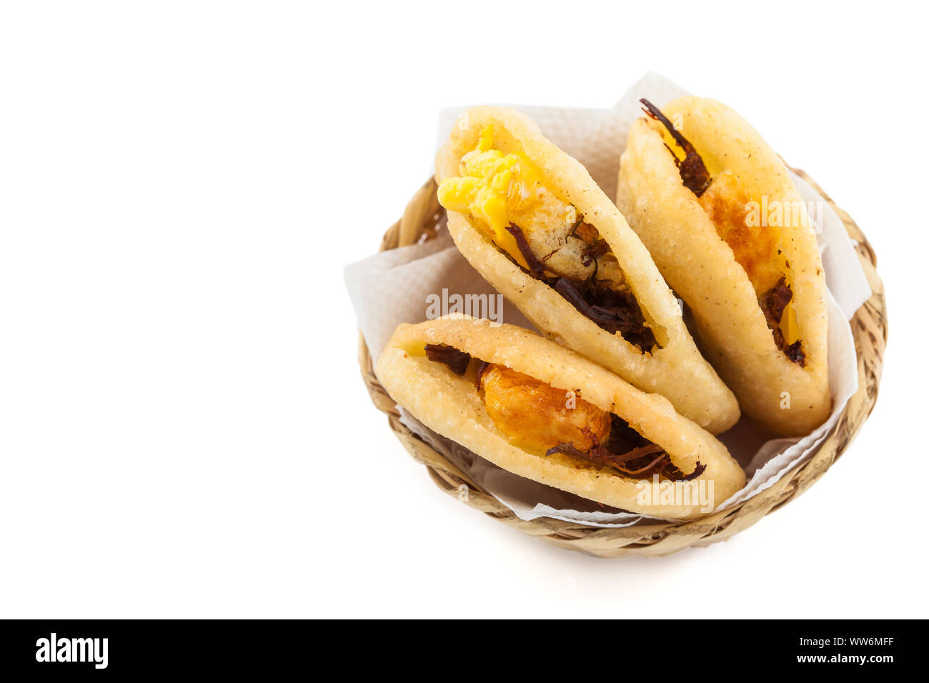Arepa de huevo. Traditional Colombian fried arepa filled with egg and ...