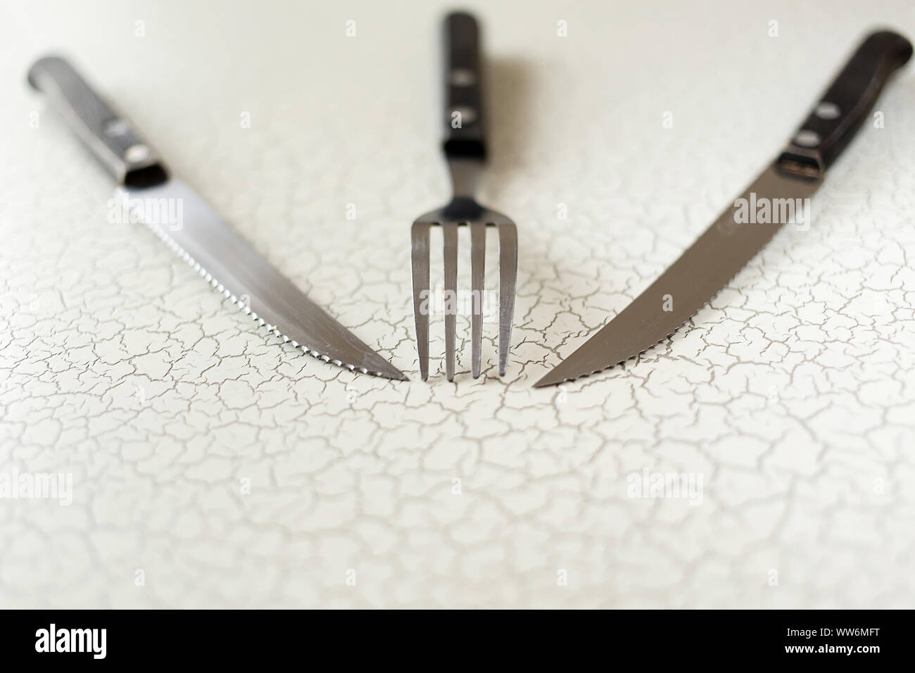 Cutlery. Composition of cutlery Two knife and fork on the table ...
