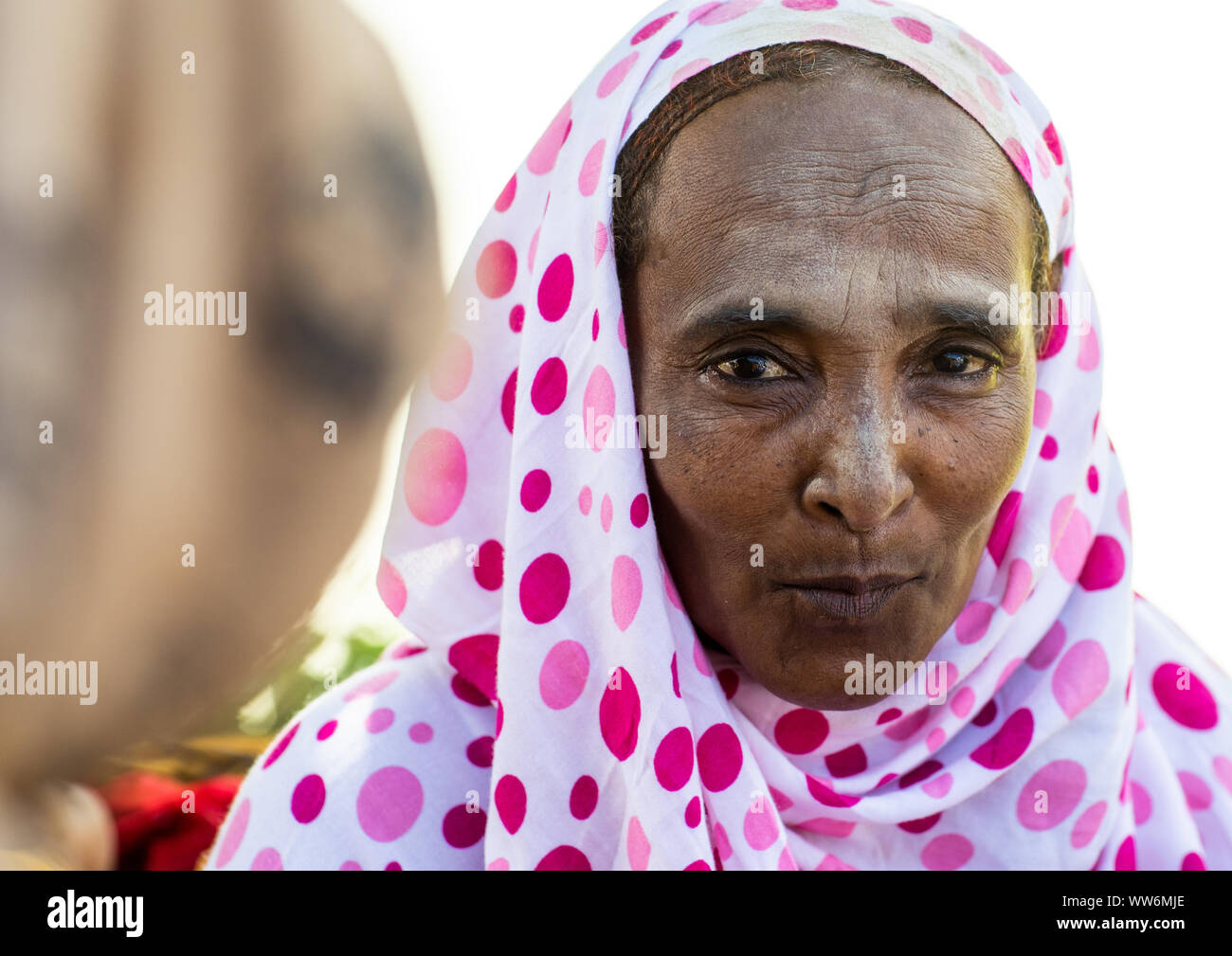 Oromo pilgrim woman in Sheikh Hussein shrine with jarawa powder on the ...