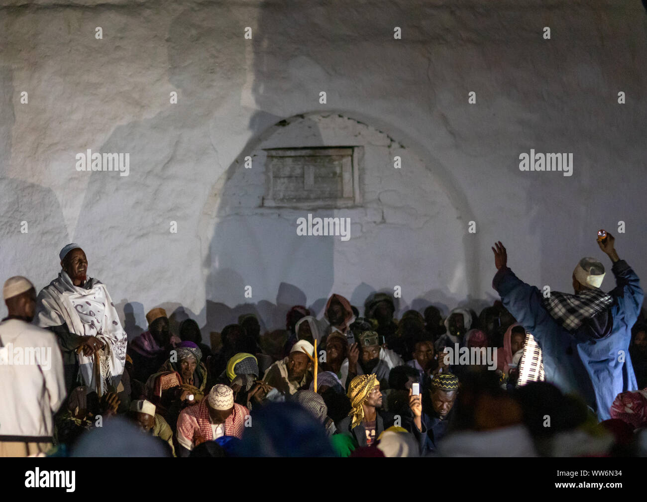 Oromo pilgrims praying in the night during the pilgrimage, Oromia ...