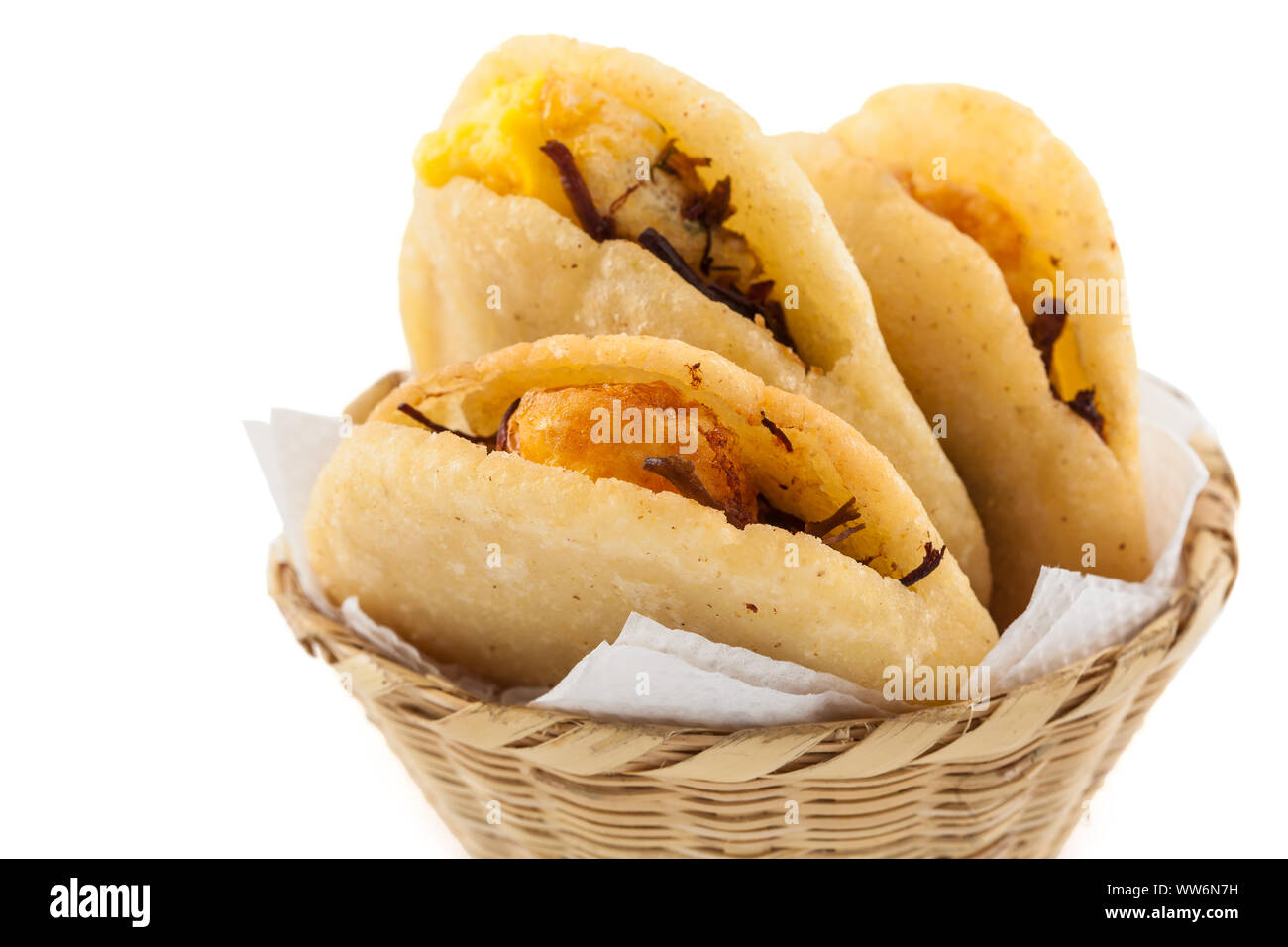 Arepa de huevo. Traditional Colombian fried arepa filled with egg and ...