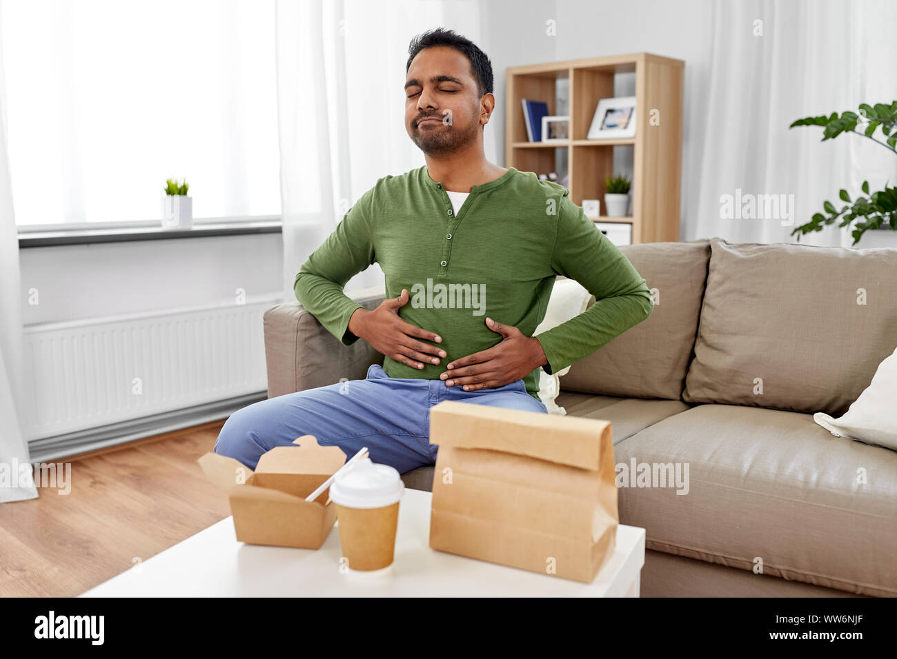 Indian man eating hi-res stock photography and images - Alamy