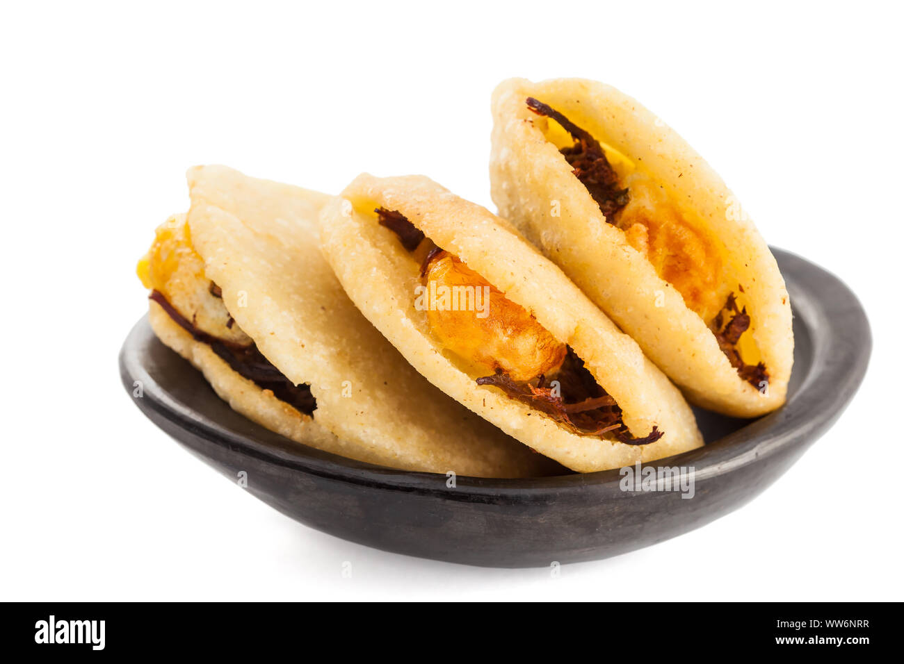 Arepa de huevo. Traditional Colombian fried arepa filled with egg and ...