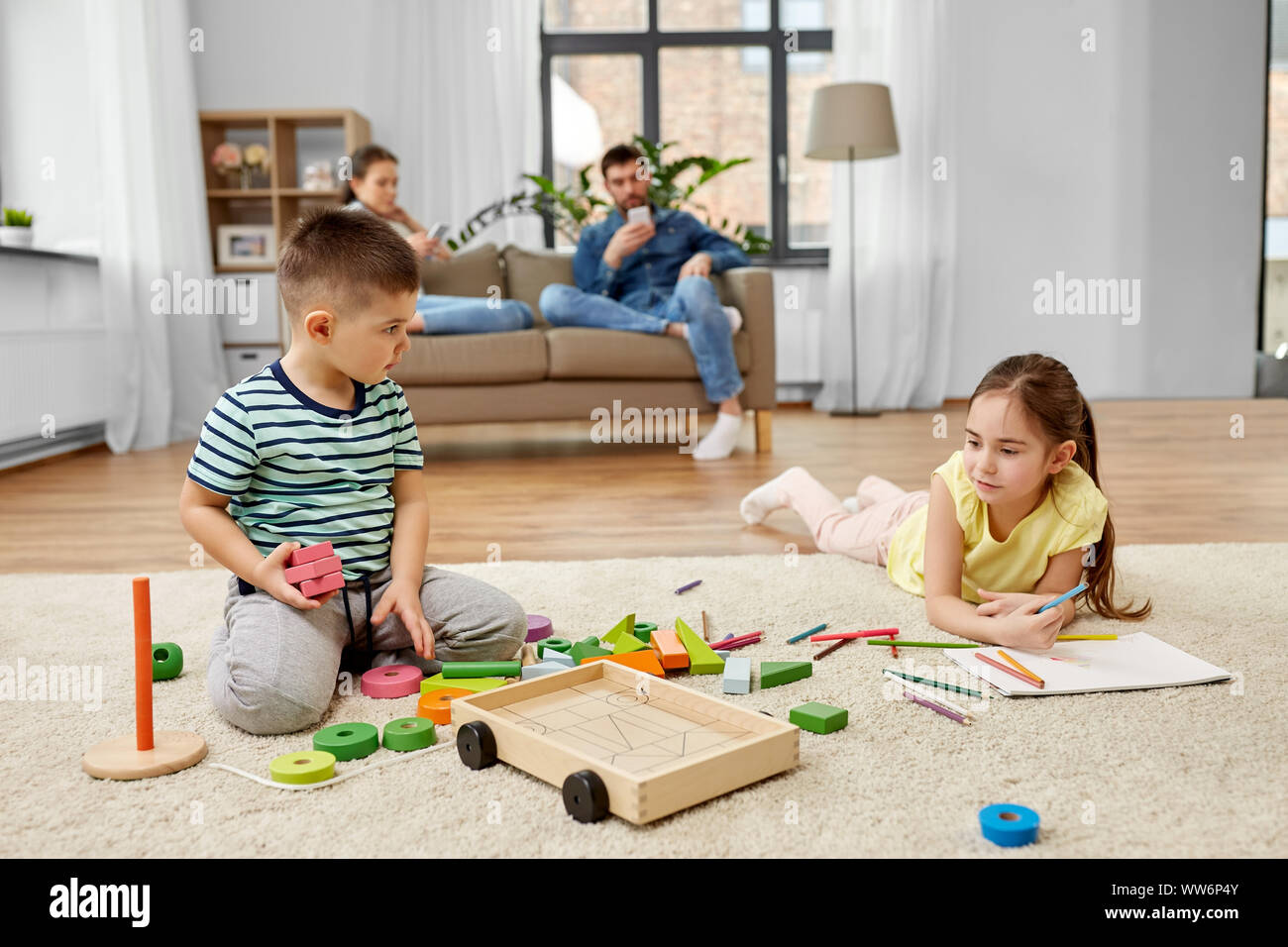 brother and sister playing and drawing at home Stock Photo - Alamy
