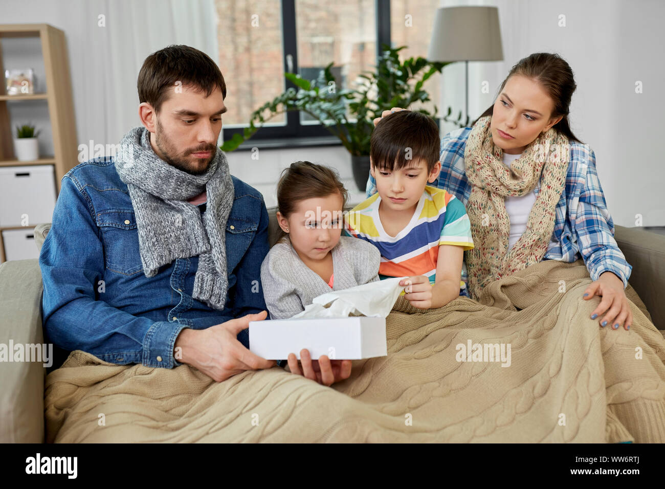 ill family with children having flu at home Stock Photo - Alamy