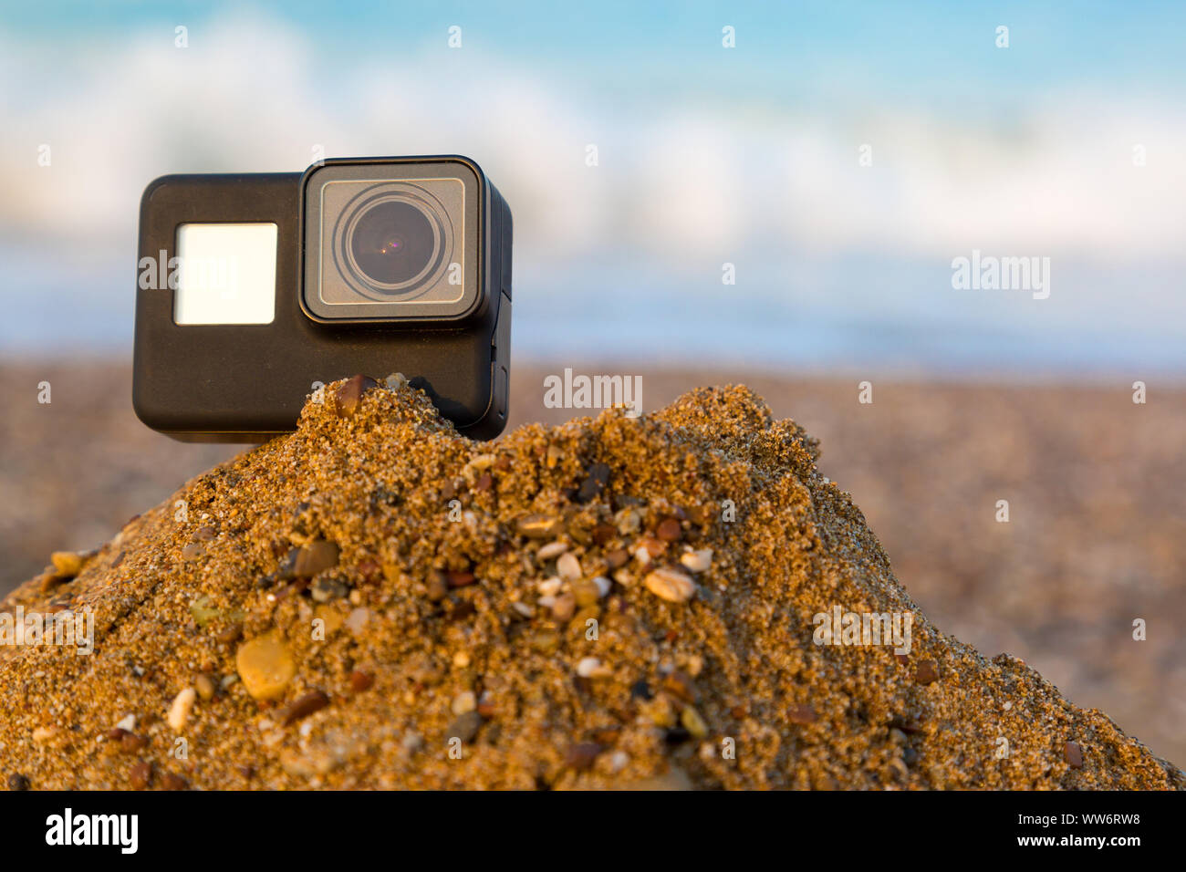 A video camera mounted for shooting on a pile of sea sand Stock Photo ...