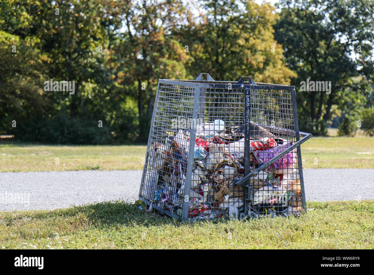 BERLIN, GERMANY - SEPTEMBER 11, 2019: Full Trash Can / Waste Bin in ...