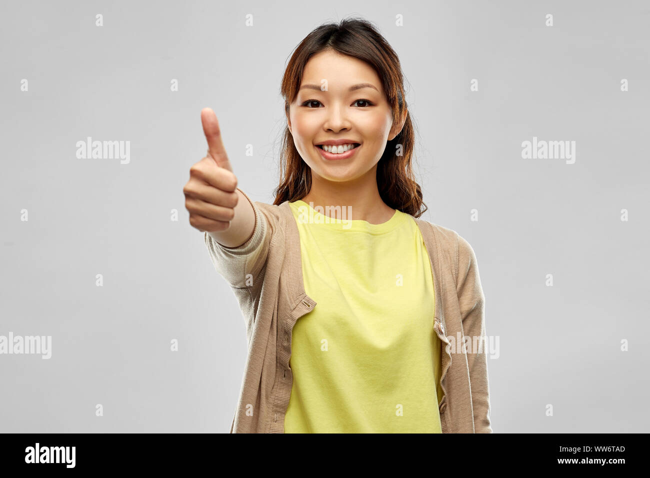 happy asian woman showing thumbs up Stock Photo - Alamy