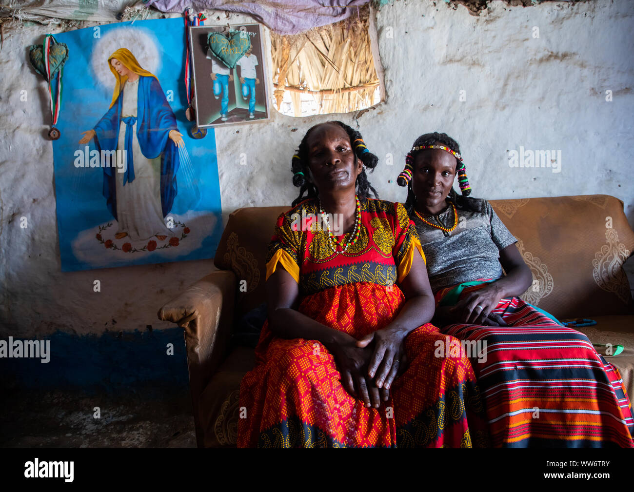 Portrait of Kunama tribe women with traditional hairstyles in front of ...