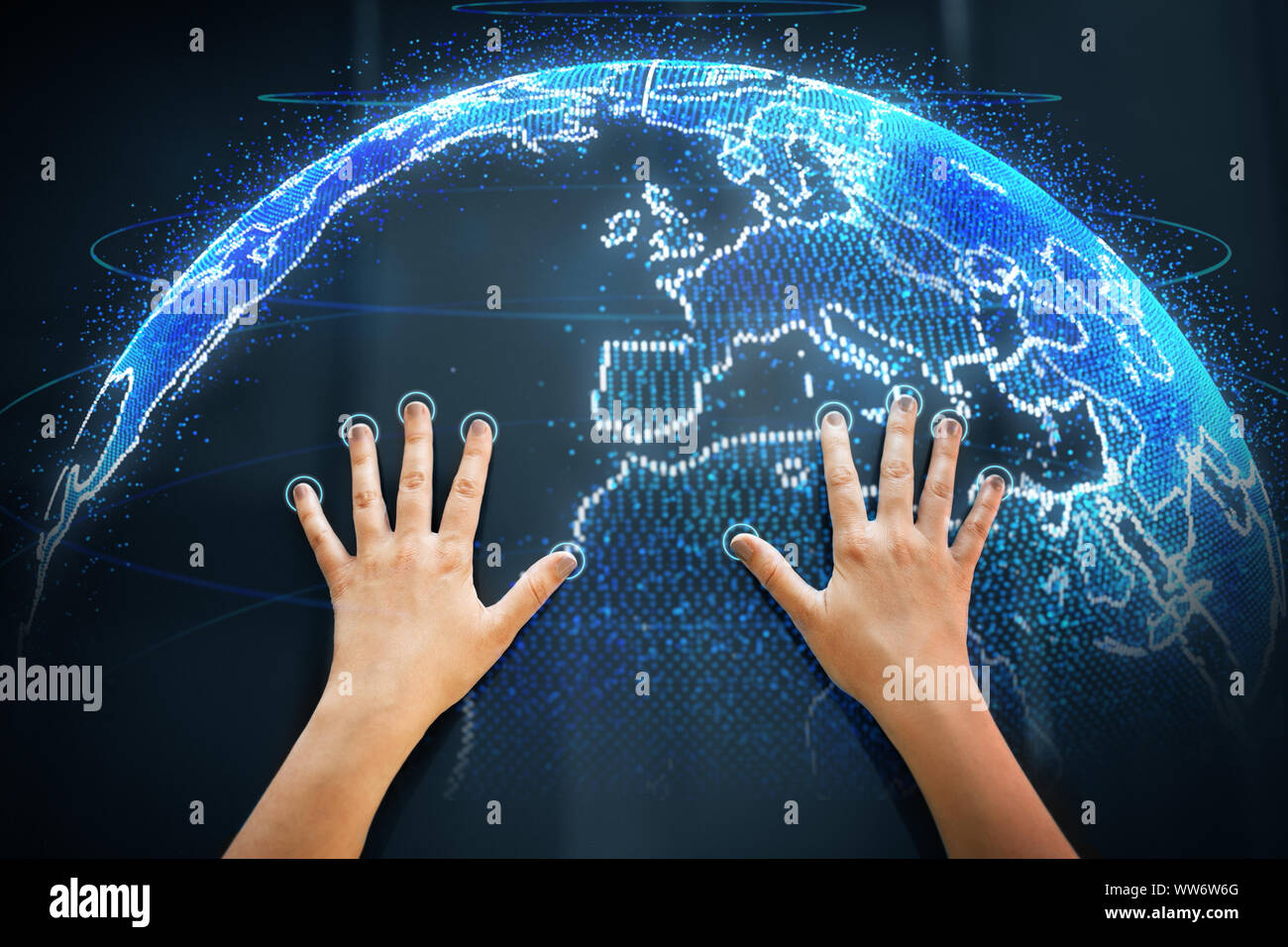 hands on touch screen with earth hologram Stock Photo - Alamy