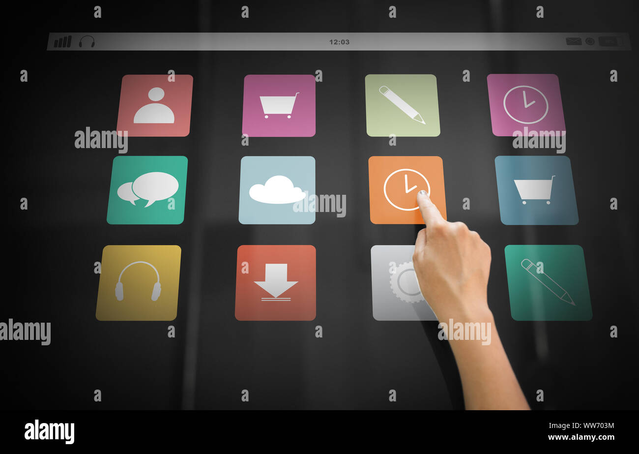 hand using interactive panel with app icons on it Stock Photo - Alamy