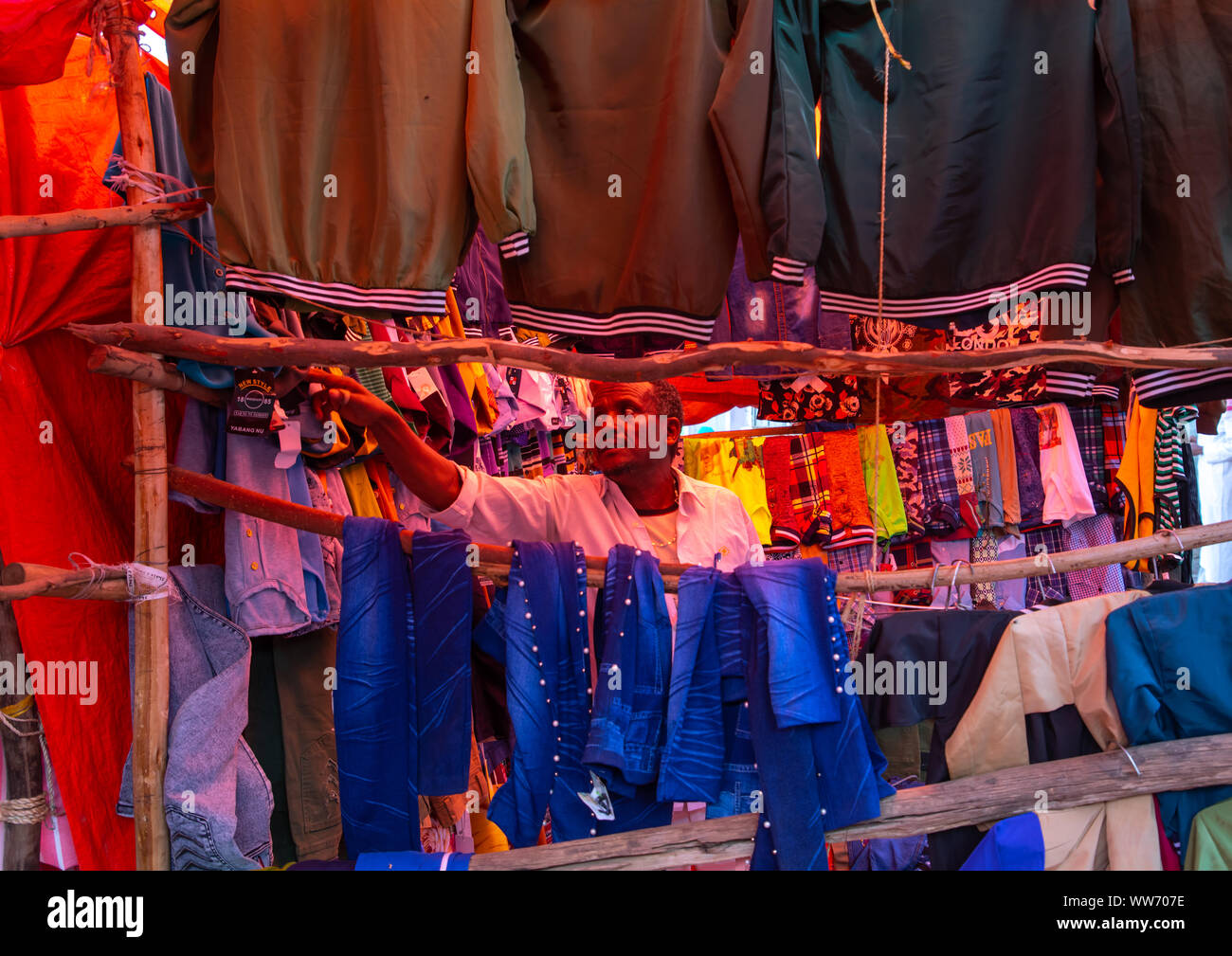 Ethiopian man selling clothes in the market, Harari region, Harar ...