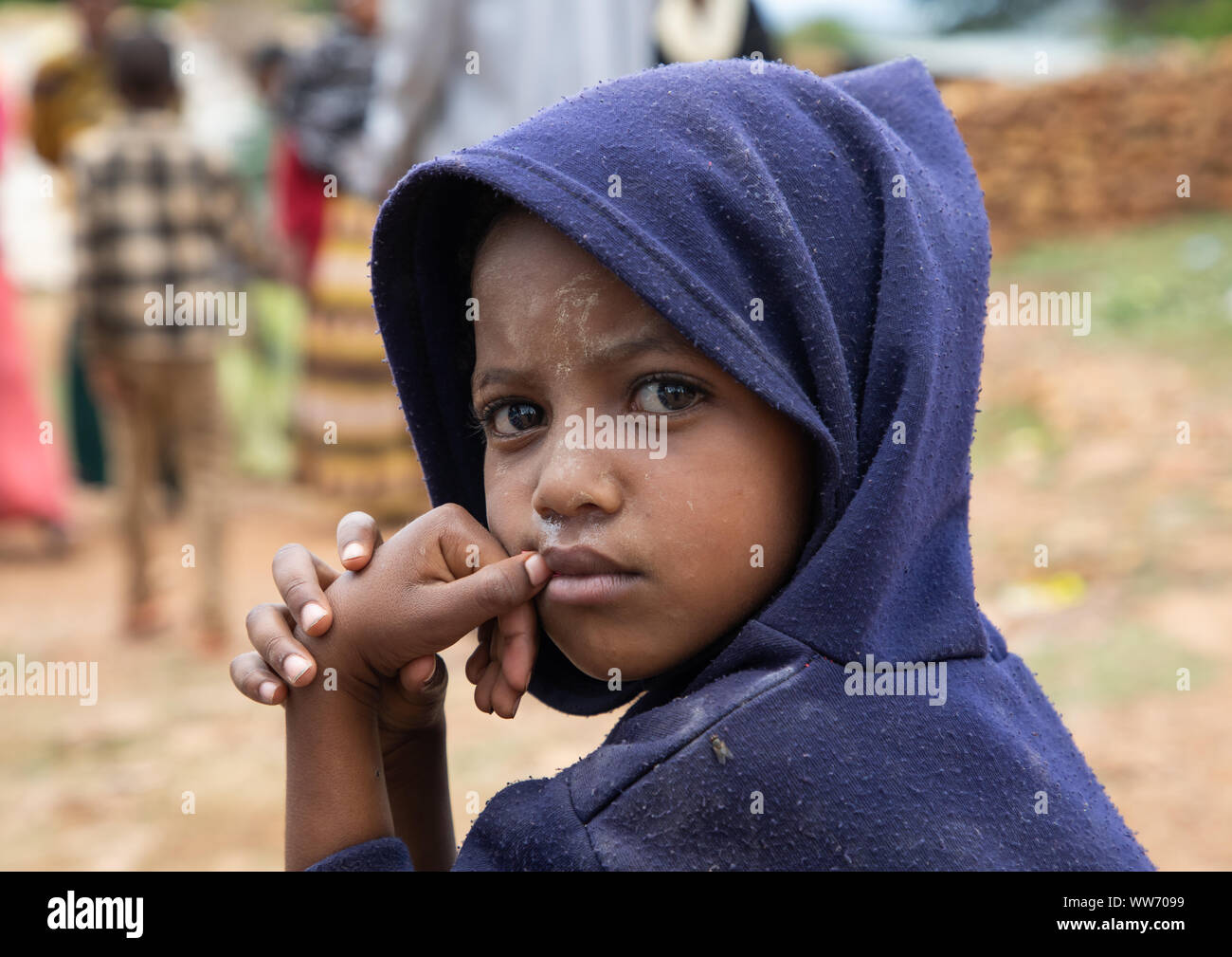 Oromo pilgrim boy in Sheikh Hussein shrine with jarawa powder on the ...