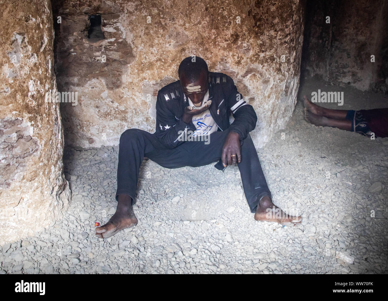 Oromo pilgrim in Sheikh Hussein shrine eating jarawa powder to cure ...