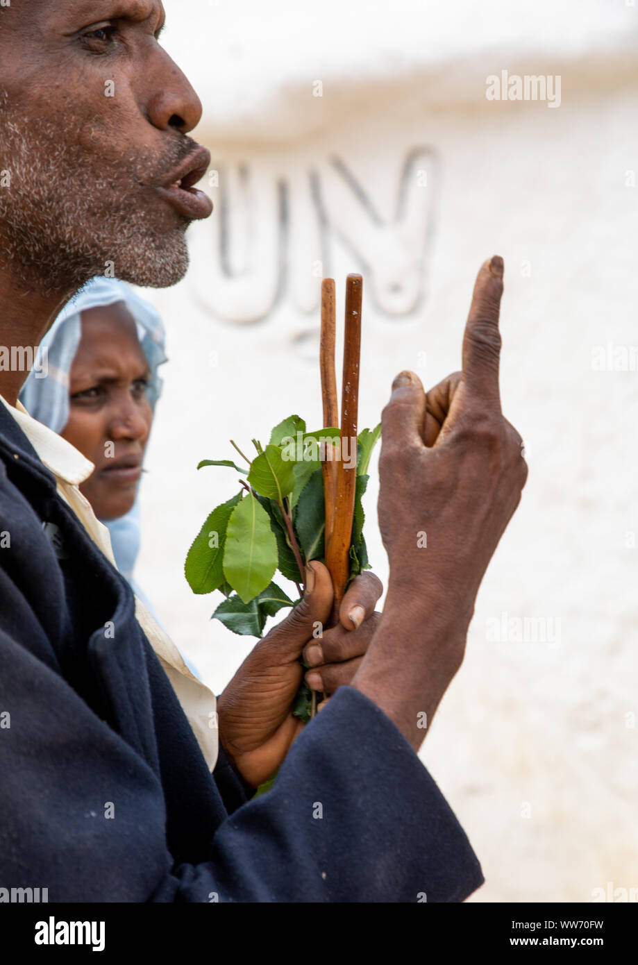 Oromo man with a forked stick in Sheikh Hussein shrine, Oromia, Sheik ...