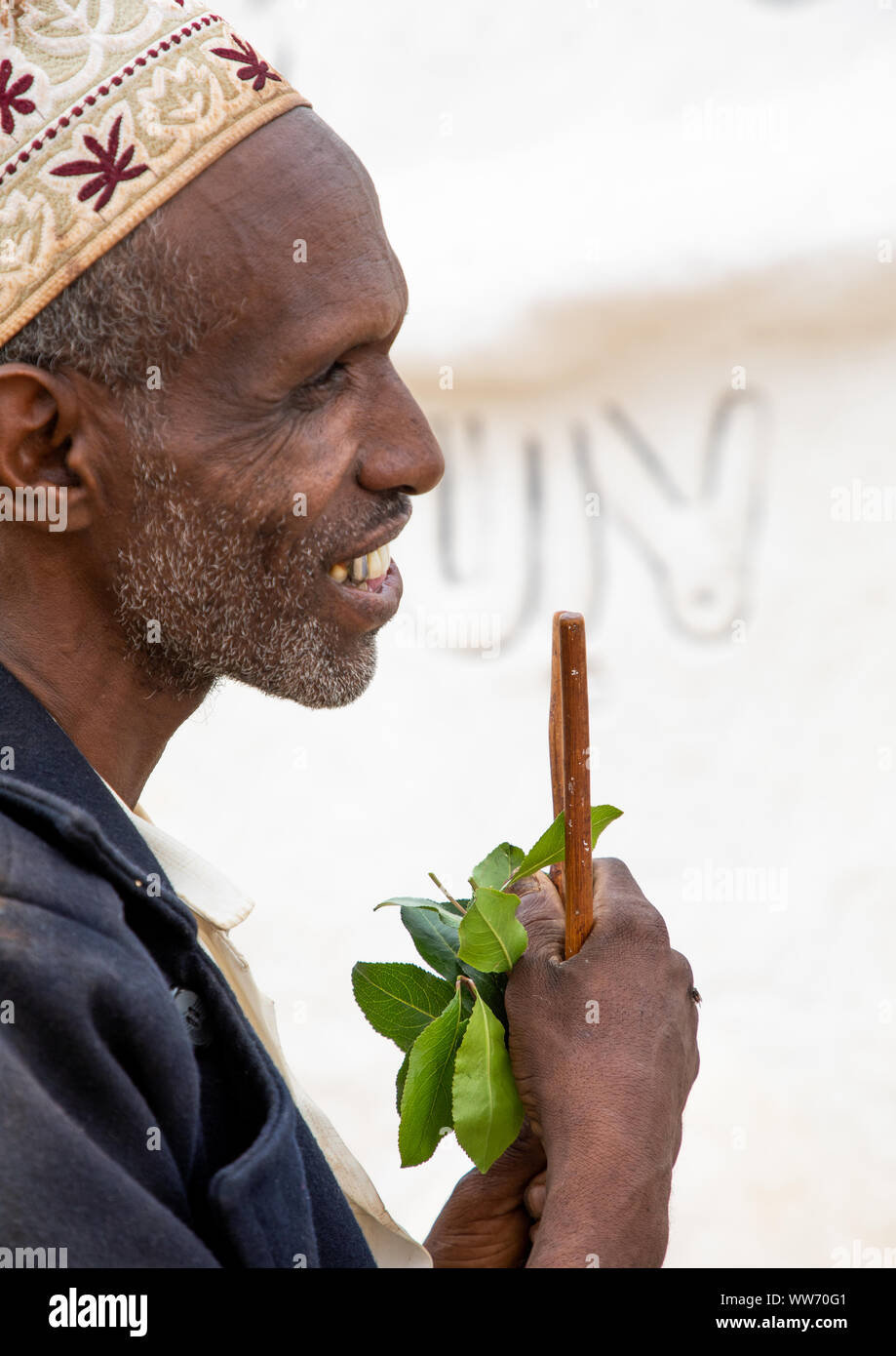 Oromo man with a forked stick in Sheikh Hussein shrine, Oromia, Sheik ...