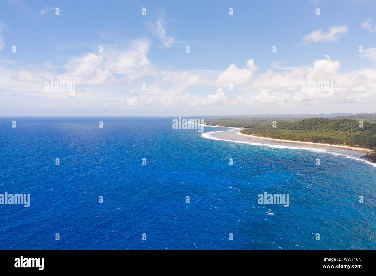 The rocky coast of a tropical island. Siargao, Philippines. Seascape ...