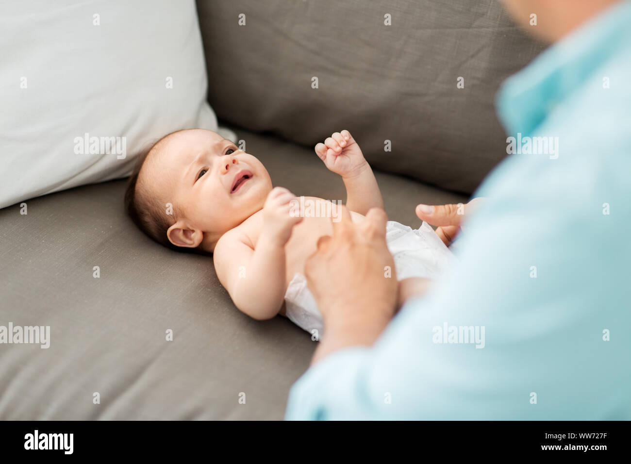 Changing babys diaper hi-res stock photography and images - Alamy