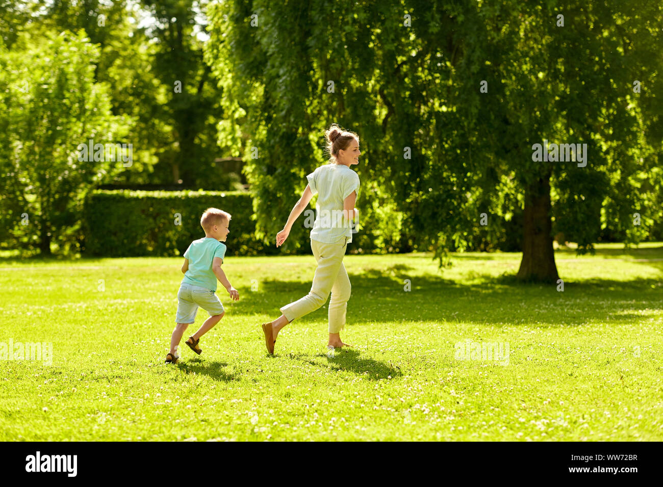 mother and son playing catch game at summer park Stock Photo - Alamy