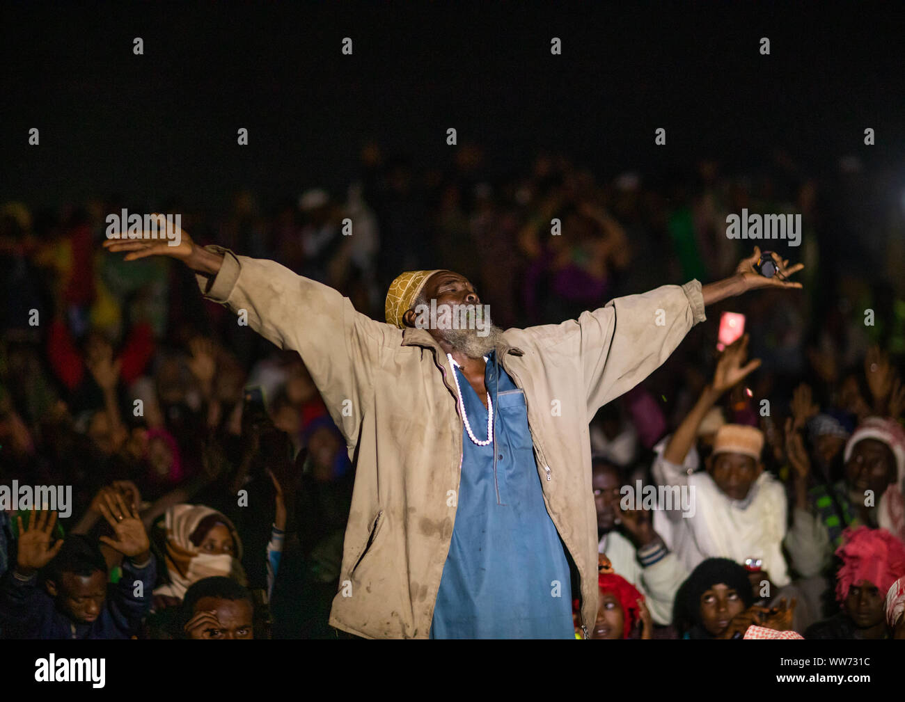 Oromo pilgrims praying in the night in Sheikh Hussein shrine, Oromia ...