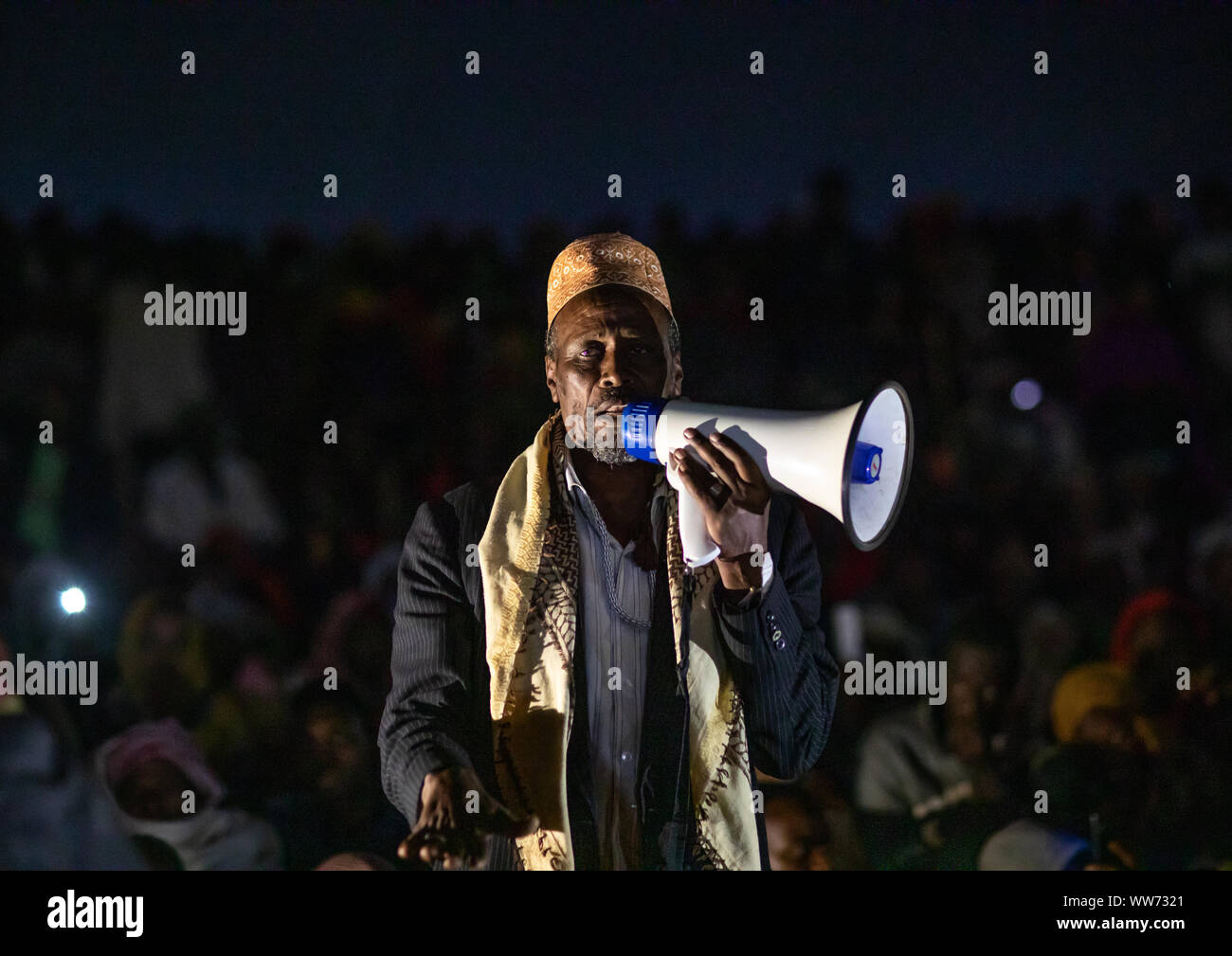 Oromo pilgrims praying in the night in Sheikh Hussein shrine, Oromia ...