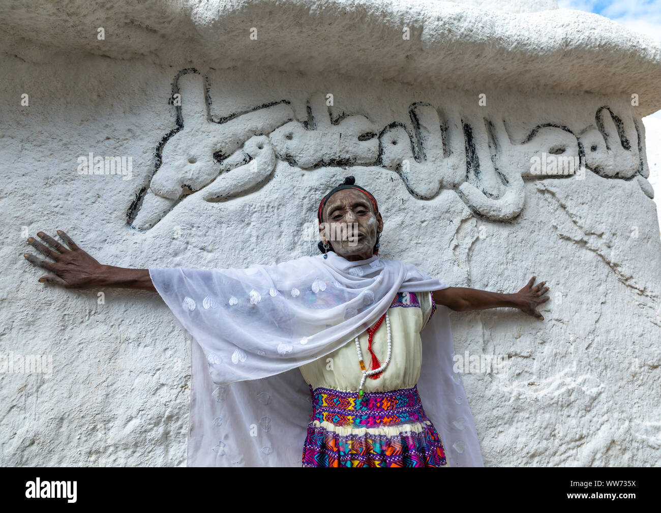 Oromo pilgrim woman in Sheikh Hussein shrine with jarawa powder on the ...