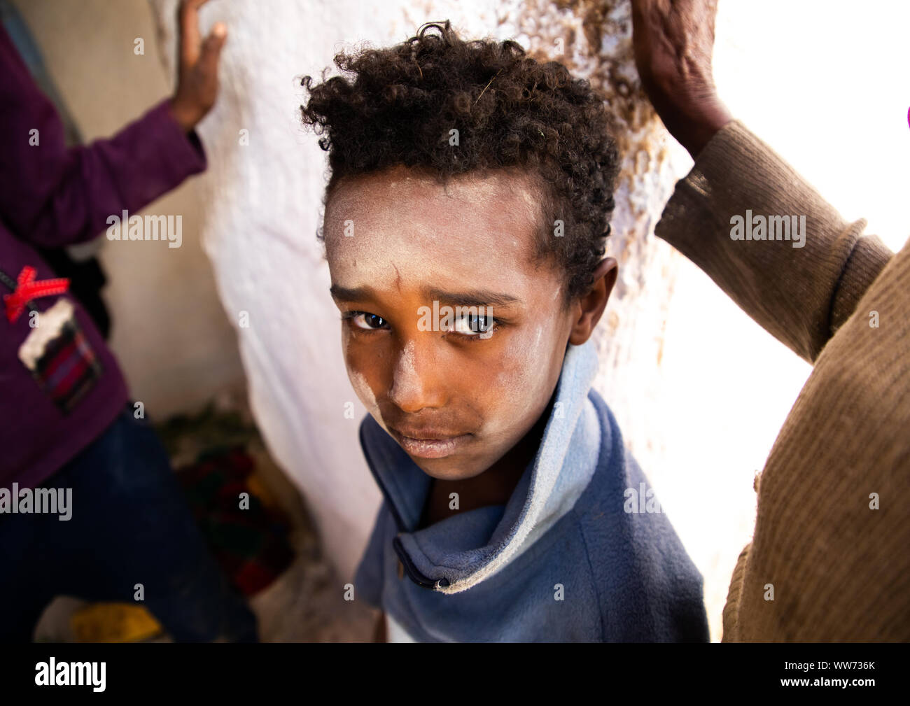 Oromo pilgrim boy in Sheikh Hussein shrine with jarawa powder on the ...