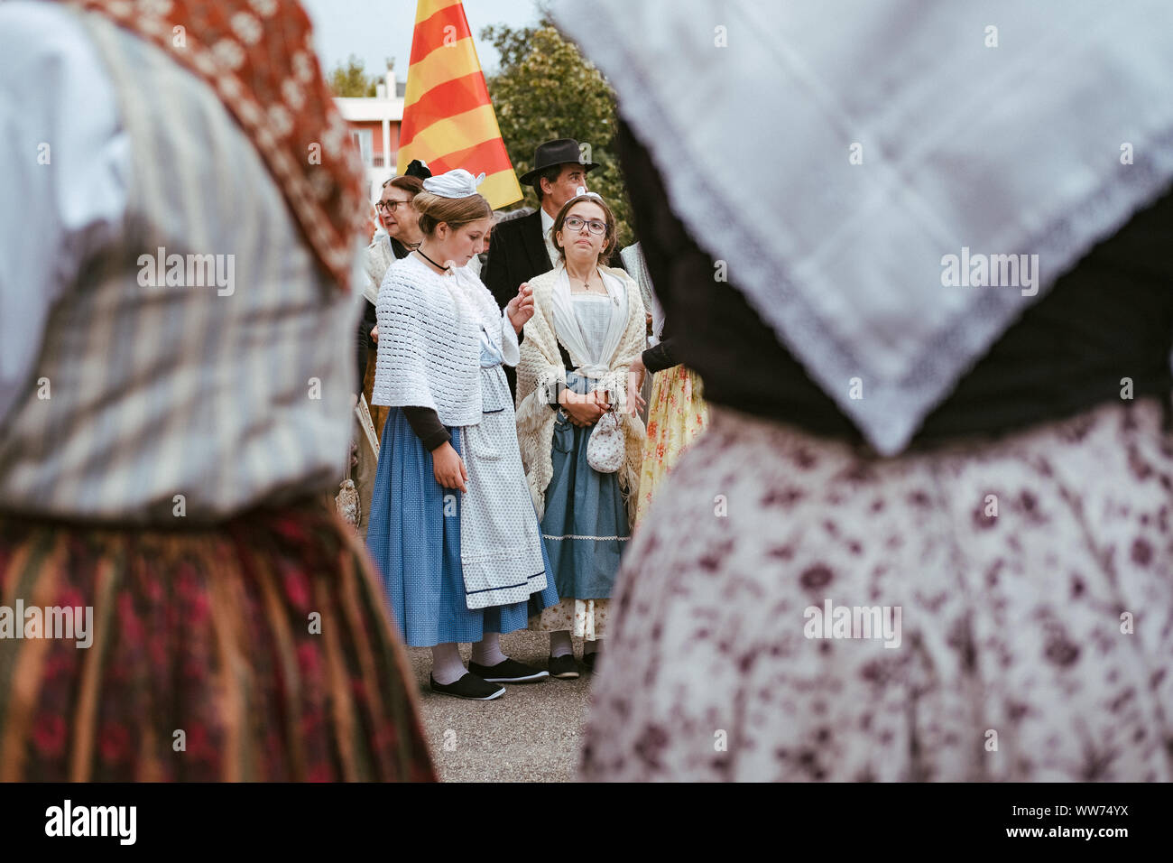 Traditionally dressed Catalans during the rice festival in Arles ...