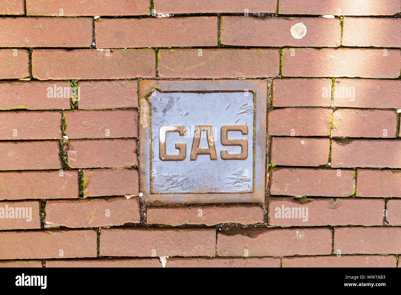 Gas Sign at Building Brick Wall Stock Photo - Alamy